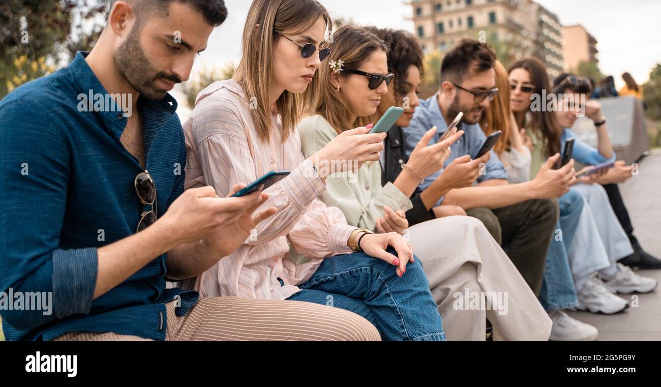 Group of young people surfing the internet watching social network ...