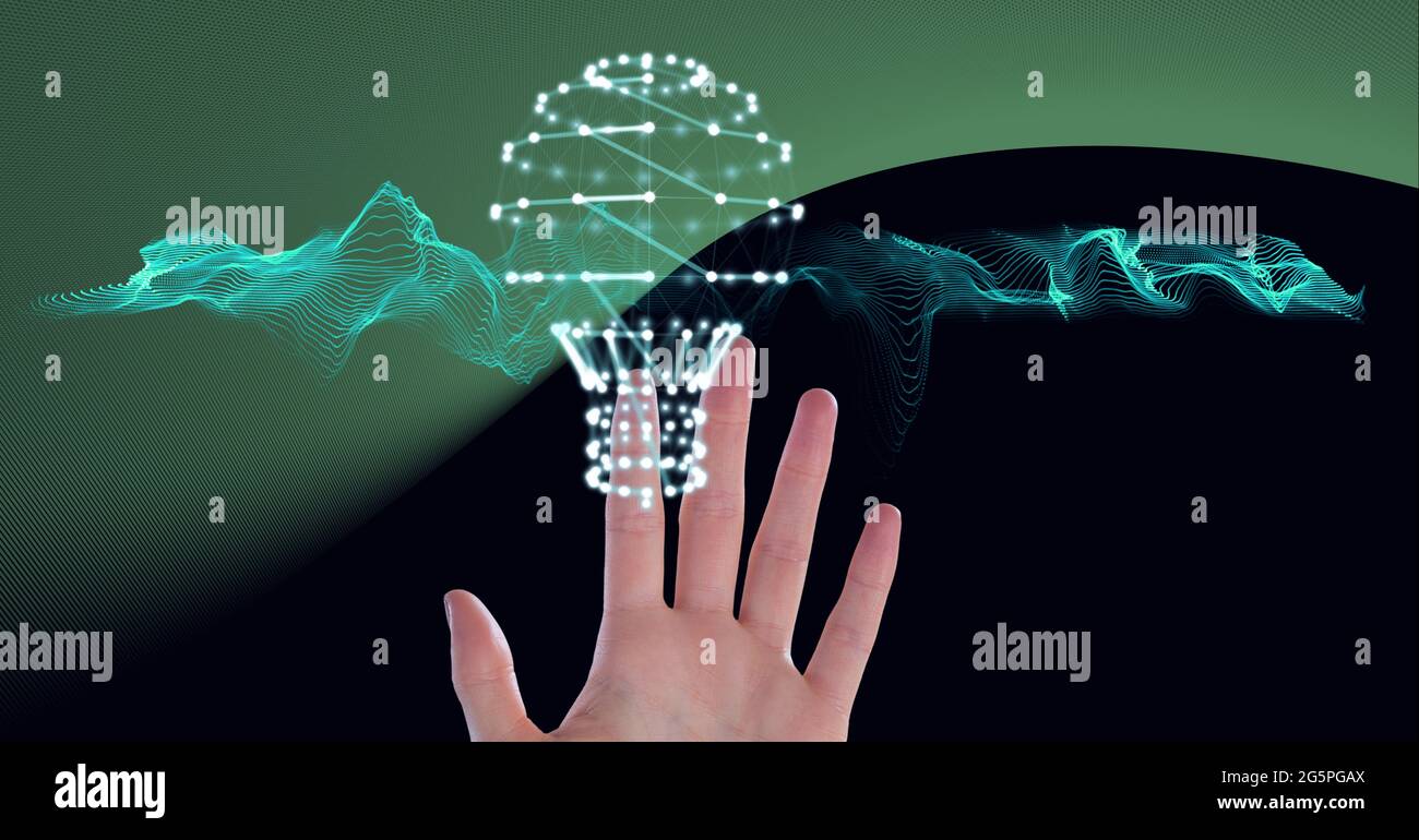 Composition of hand touching screen with lightbulb on black background ...