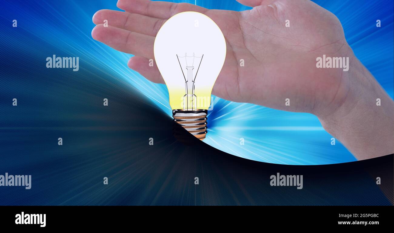 Composition of blue light trails with hand over lightbulb on blue Stock ...