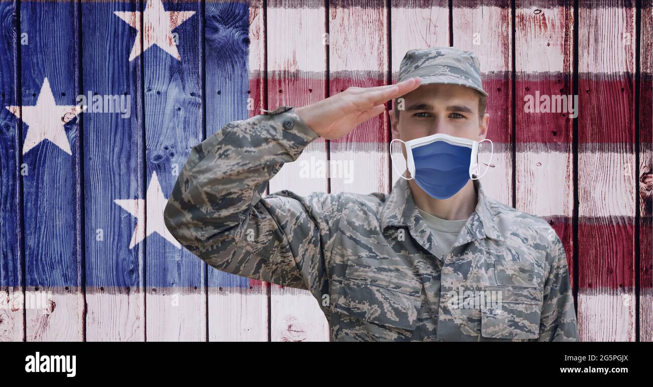 Composition of saluting soldier wearing face mask, against american ...