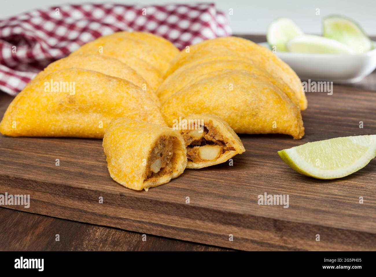 Tasty empanadas - Colombian cuisine; photo on wooden background Stock ...