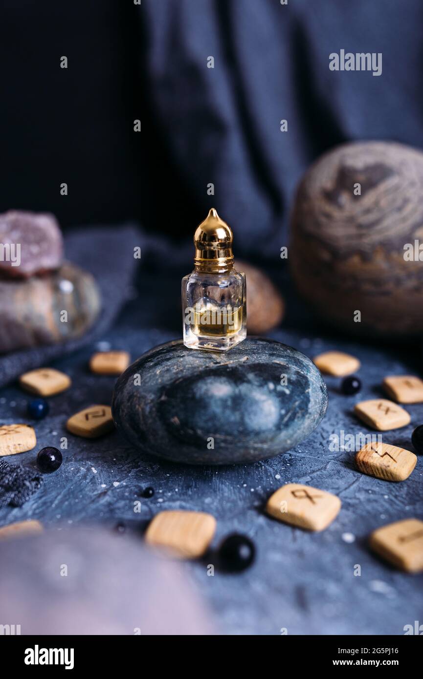 Small glass bottle with natural magic oil. Cosmetic and magic elixir ...