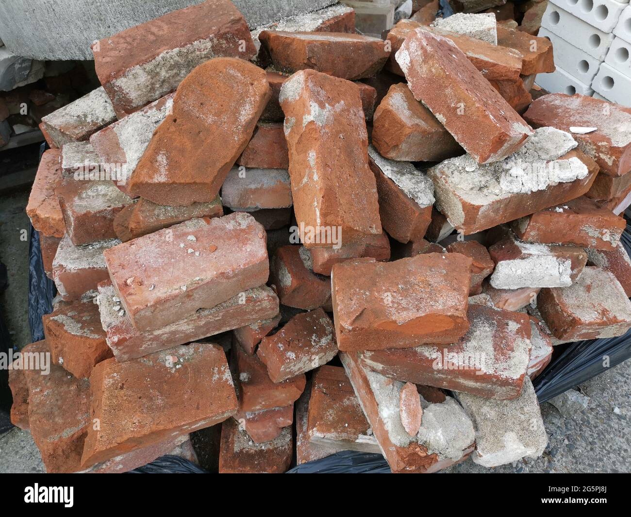 Closeup shot of a pile of used old bricks Stock Photo - Alamy