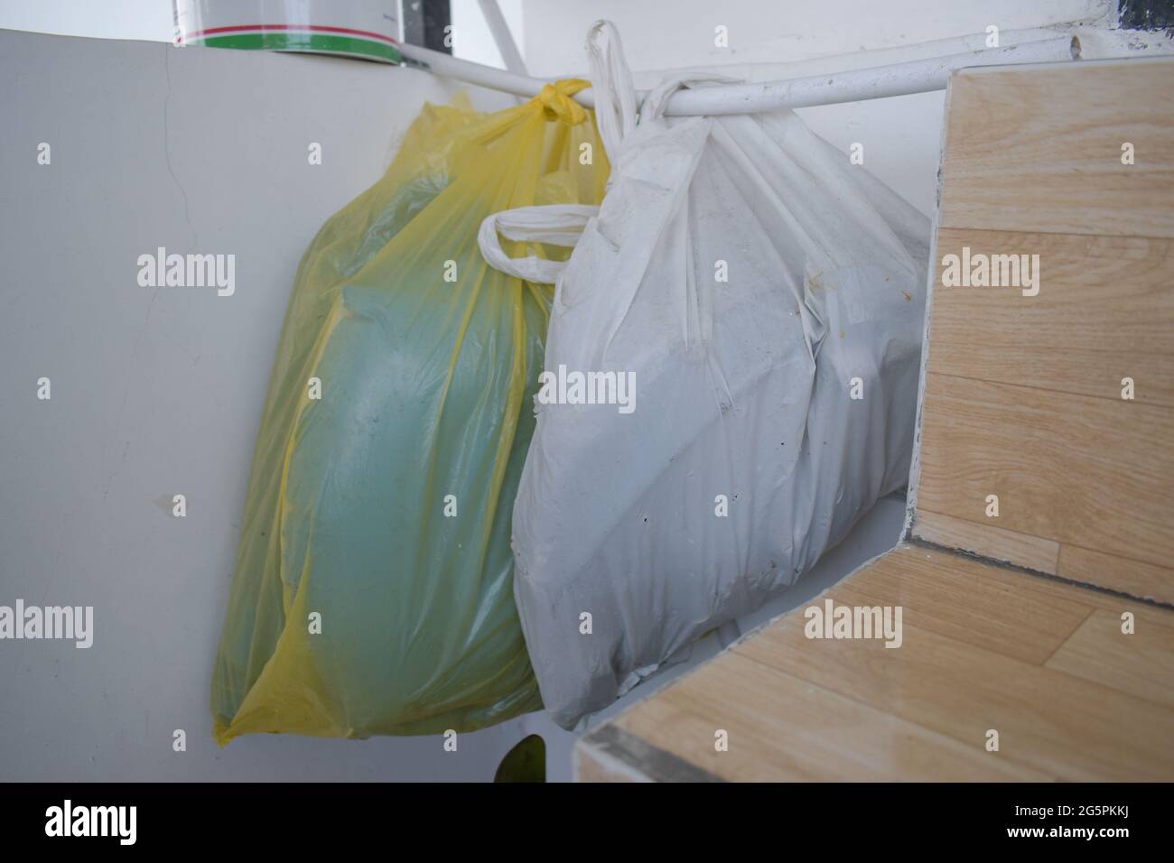 yellow and white plastic. The plastic is used to wrap some objects and ...