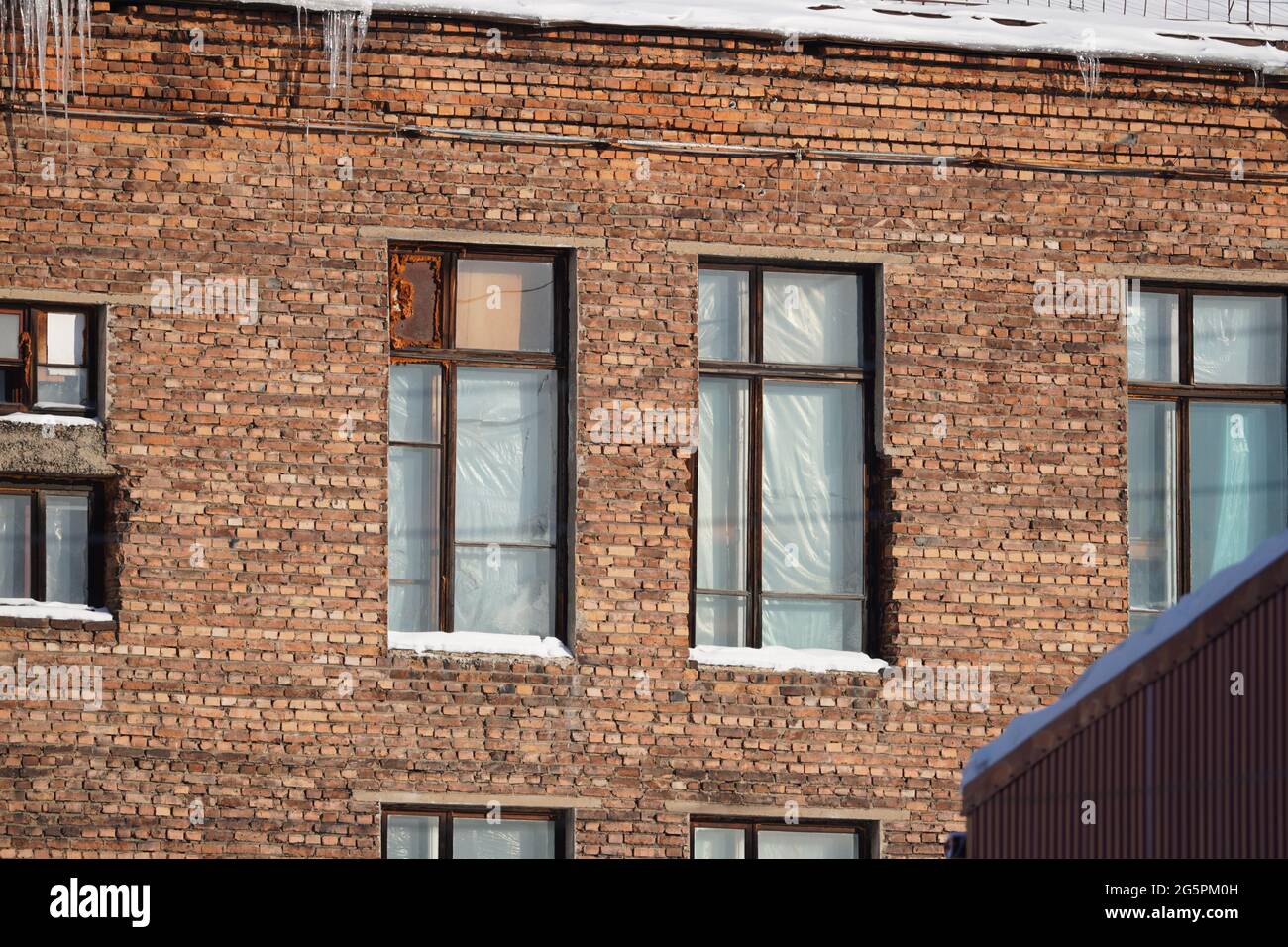 windows on an old brick building Stock Photo - Alamy