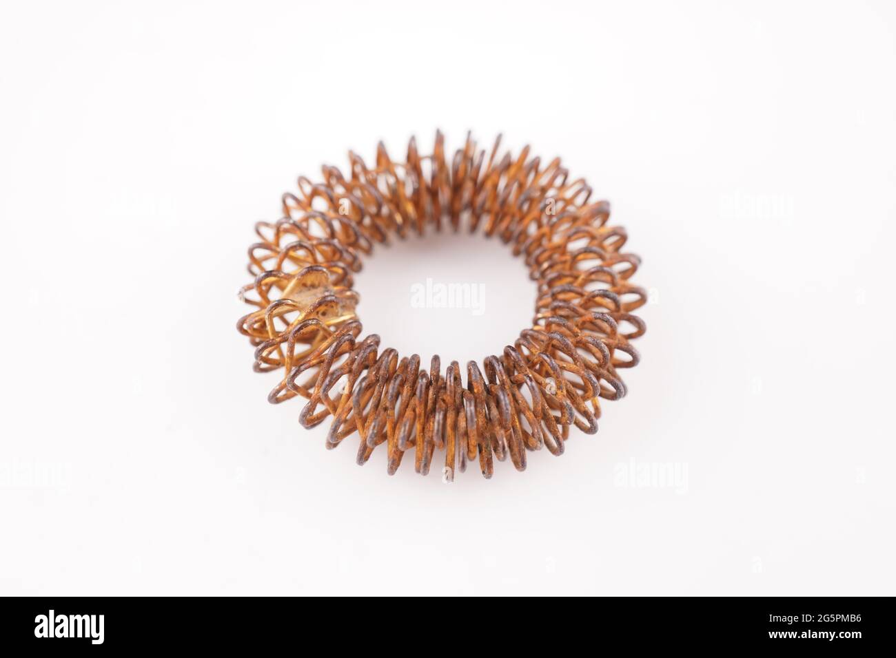 orange metal spring on white background Stock Photo - Alamy