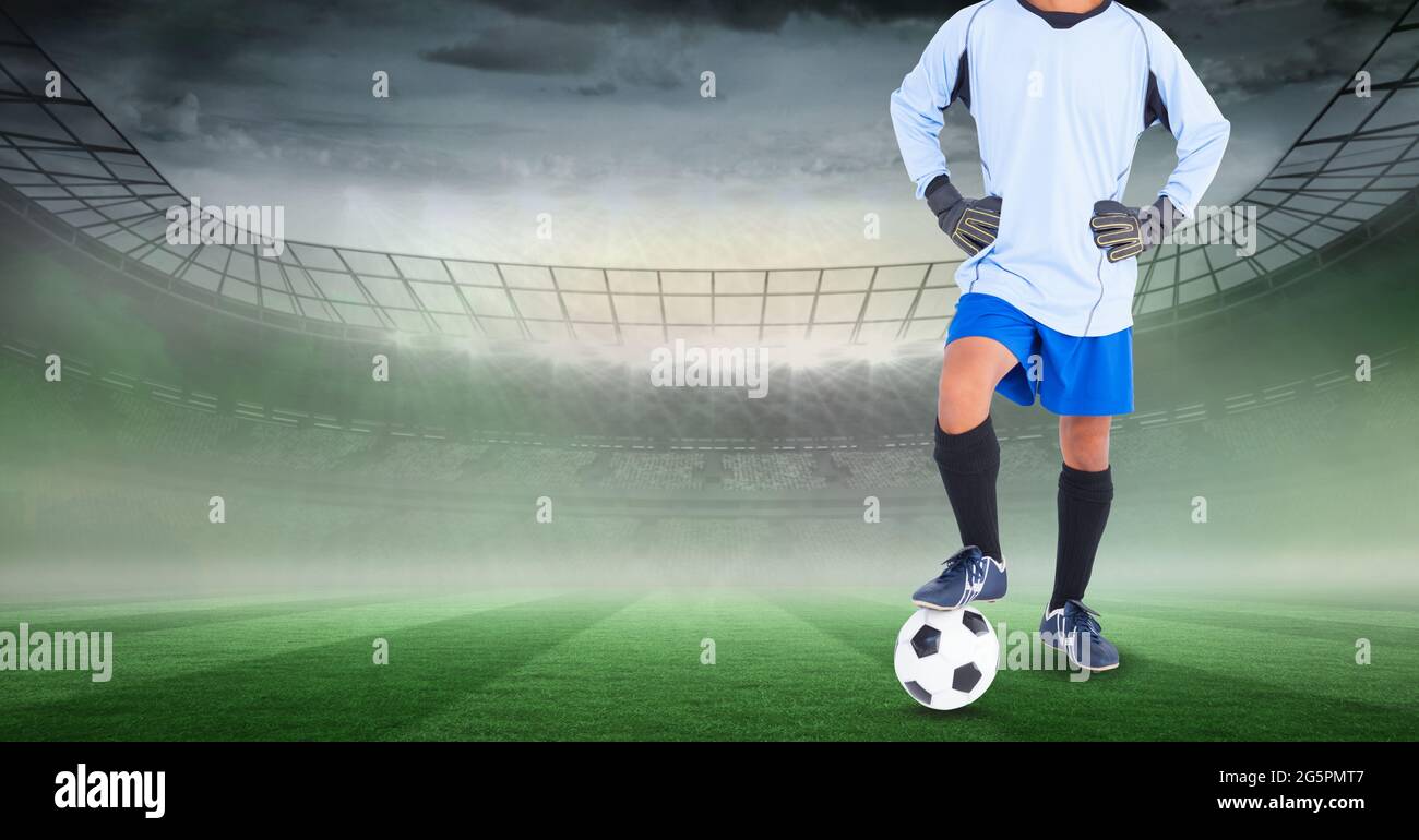 Composition of male football player with ball at stadium Stock Photo ...