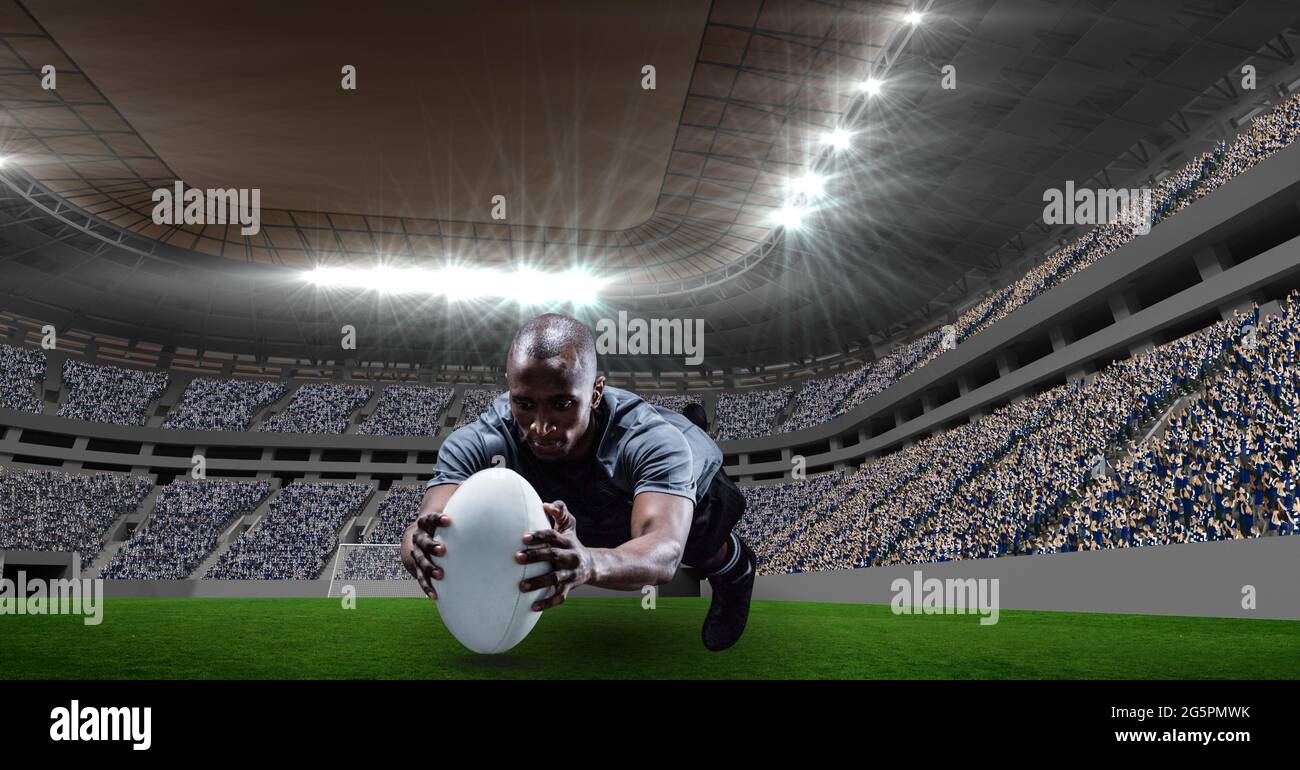 Composition of male rugby player catching ball at stadium Stock Photo ...
