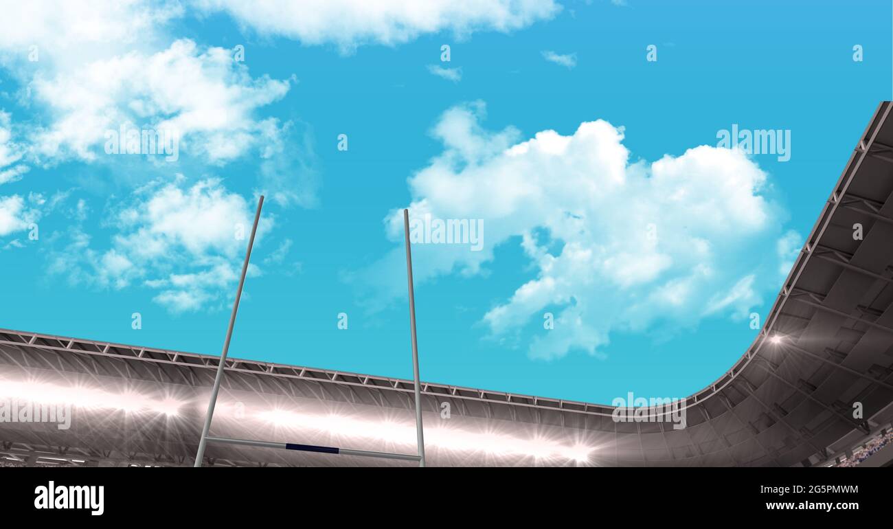 Composition of empty rugby stadium with lights over blue sky and clouds ...