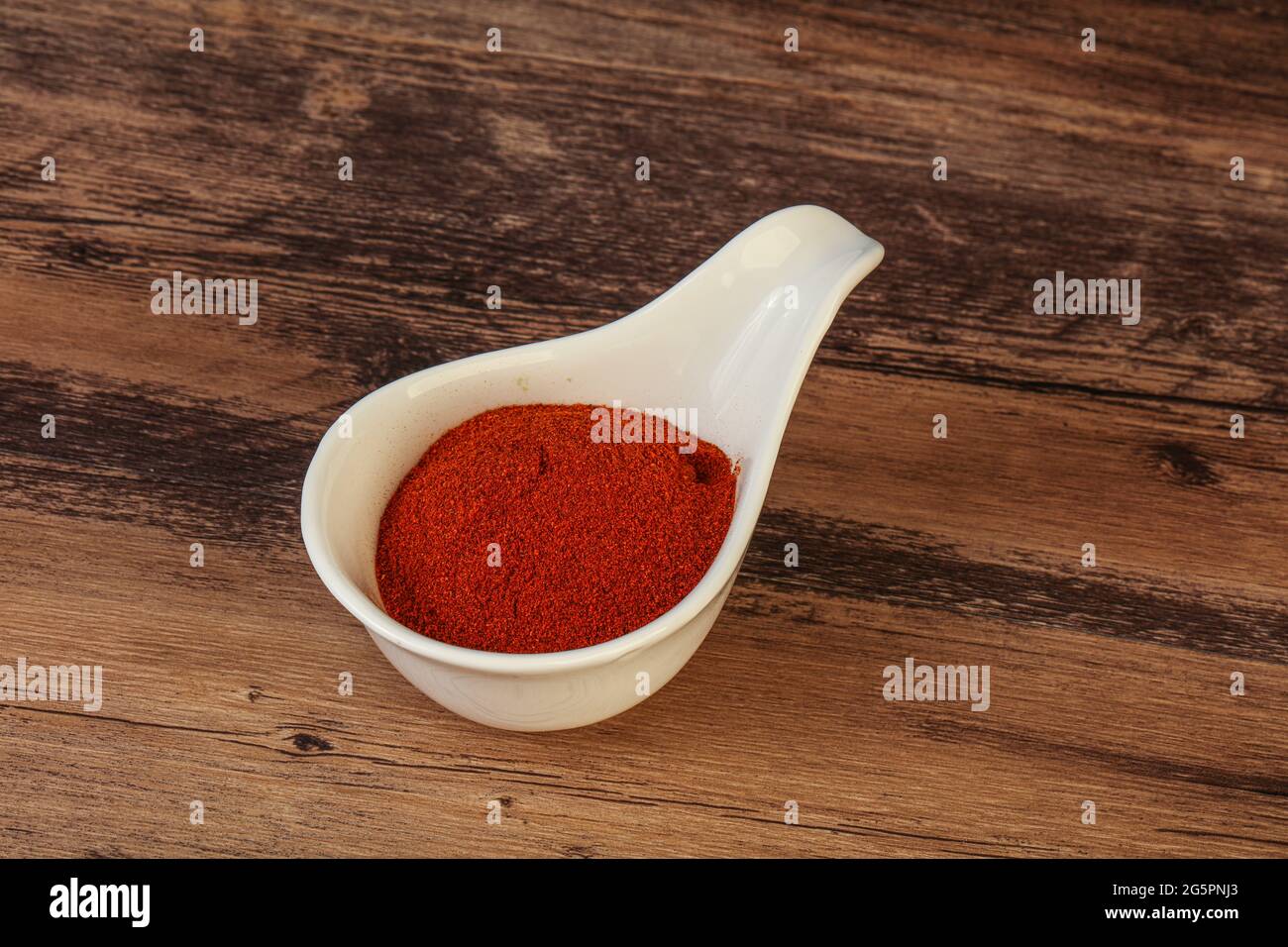 Dry paprika powder in the bowl for cooking Stock Photo - Alamy