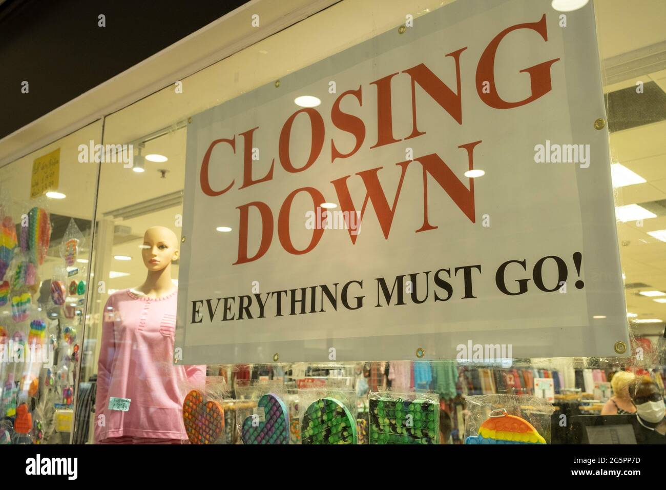 Closing Down, everything must go sign in a closing shop window on 23rd ...
