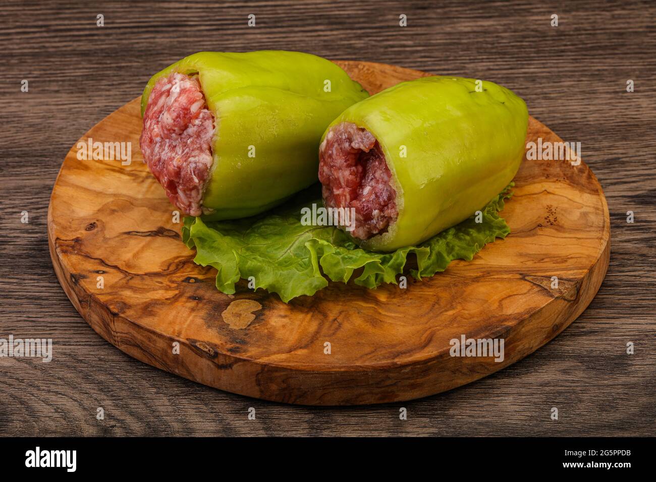 Raw stuffed green bell pepper with meat Stock Photo - Alamy