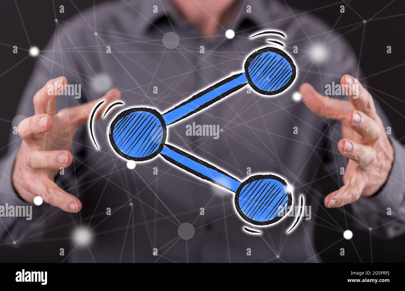 Share concept between hands of a man in background Stock Photo - Alamy
