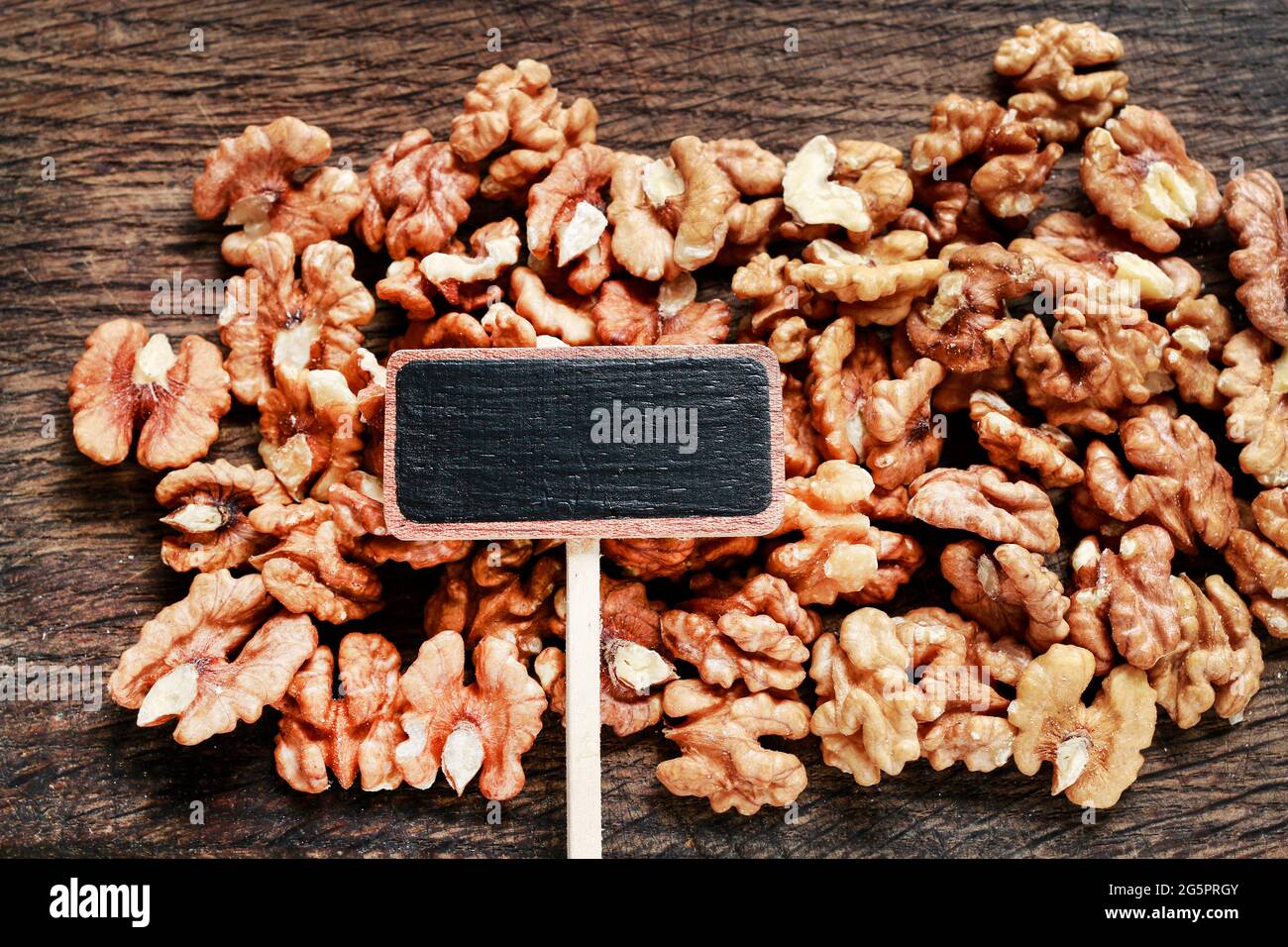 Walnuts and blank blackboard label. Graphic resources Stock Photo - Alamy
