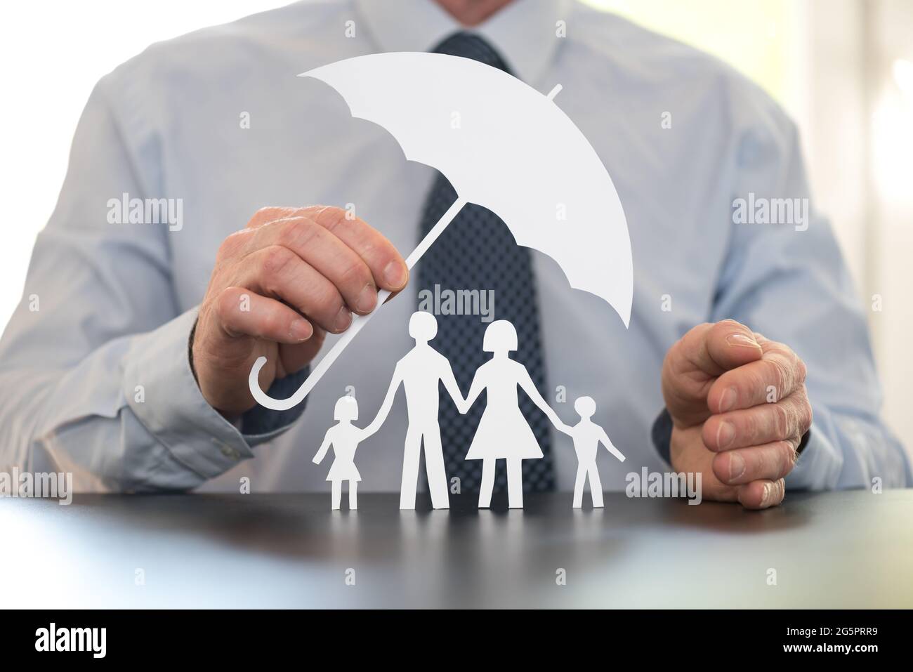 Symbol of family protection by a general agent Stock Photo - Alamy
