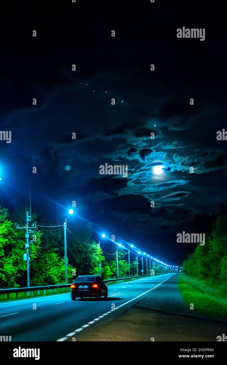 a picturesque, bright, colorful night landscape with a highway Stock ...