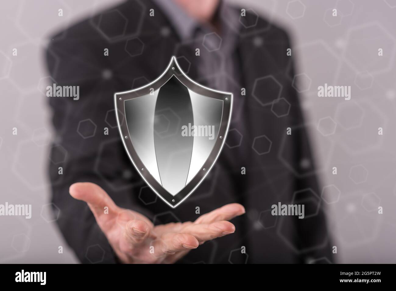 Protection concept above the hand of a man in background Stock Photo ...