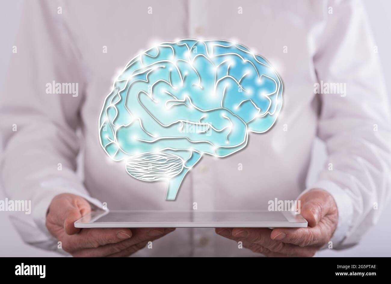 Artificial intelligence concept above a tablet held by a man in ...