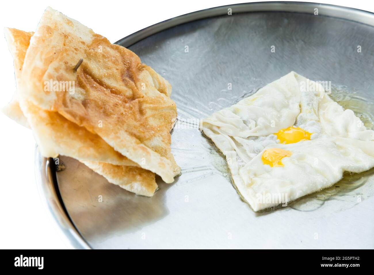 Hot crispy Roti with eggs, sweet dessert fried on hot pan Stock Photo ...