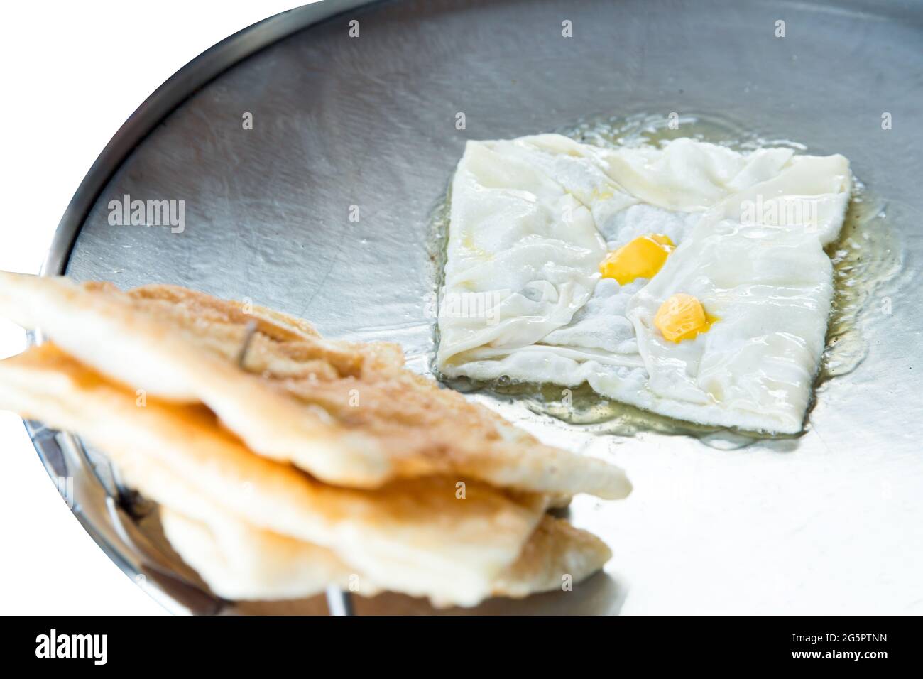 Hot crispy Roti with, sweet dessert fried on hot pan Stock Photo - Alamy