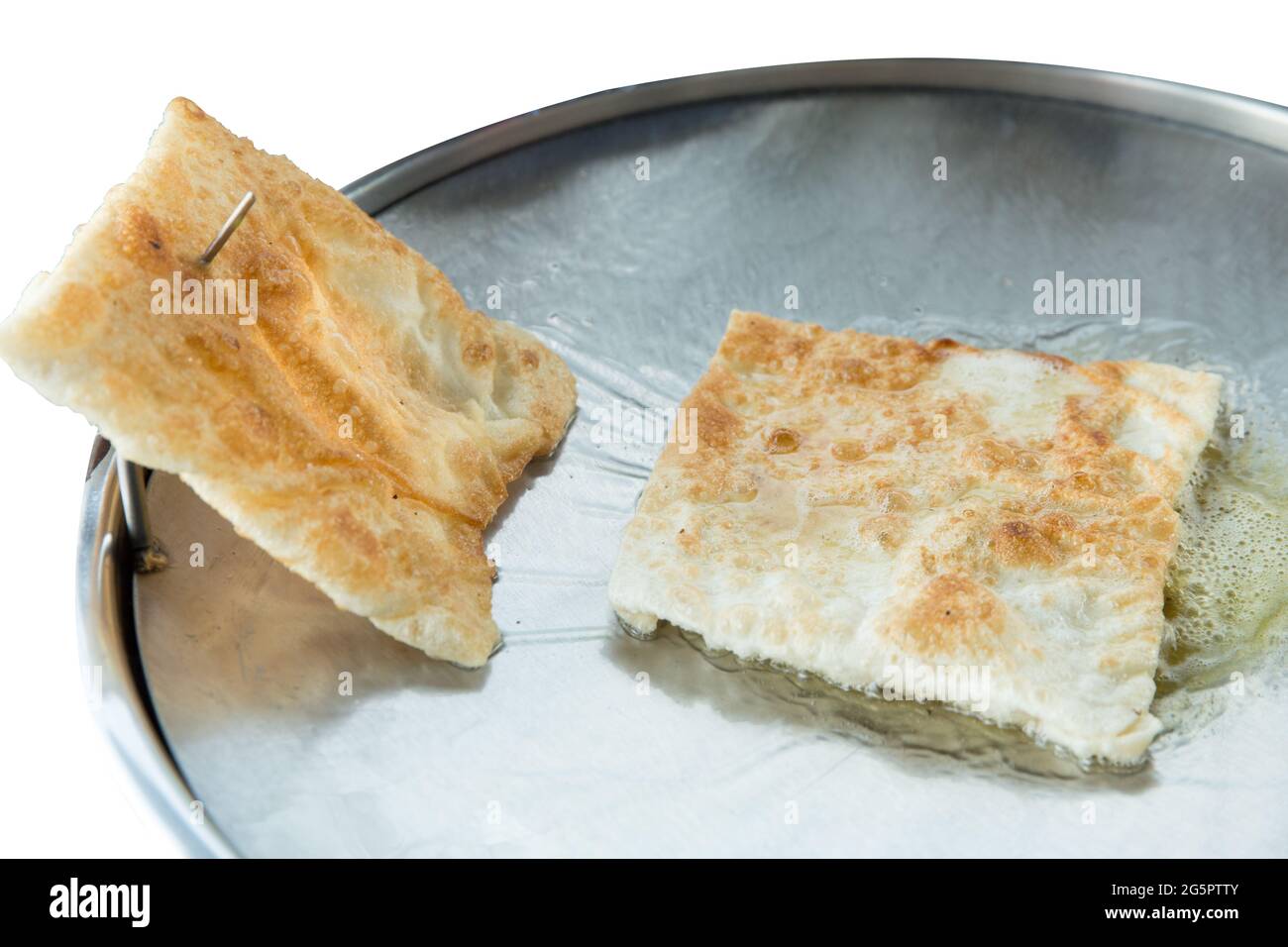 Hot crispy Roti with, sweet dessert fried on hot pan Stock Photo - Alamy