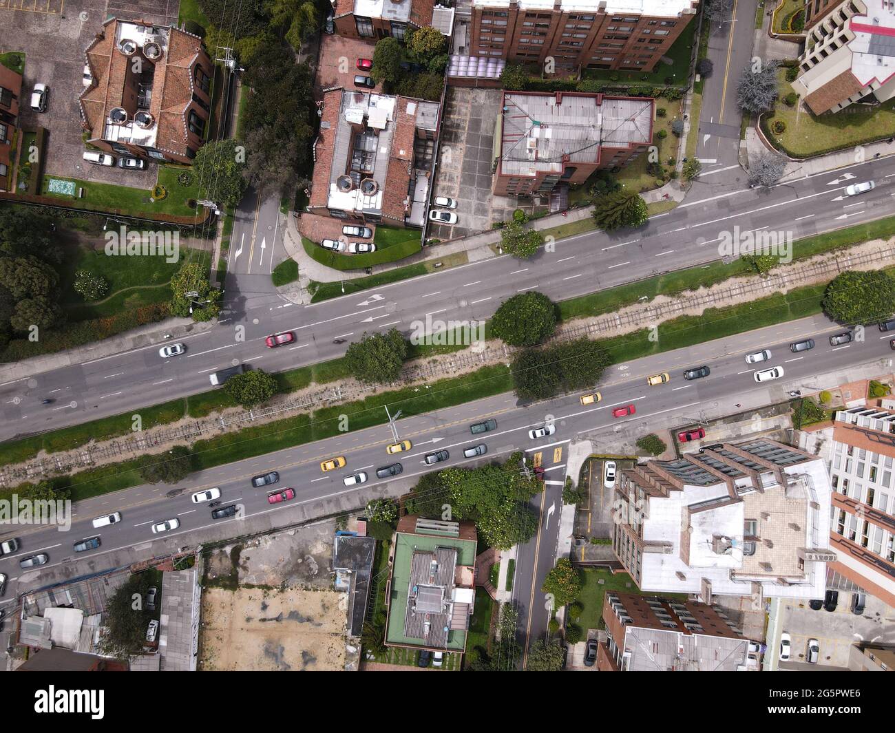 Aerial view of the streets of Bogota, Colombia with cars traveling on ...