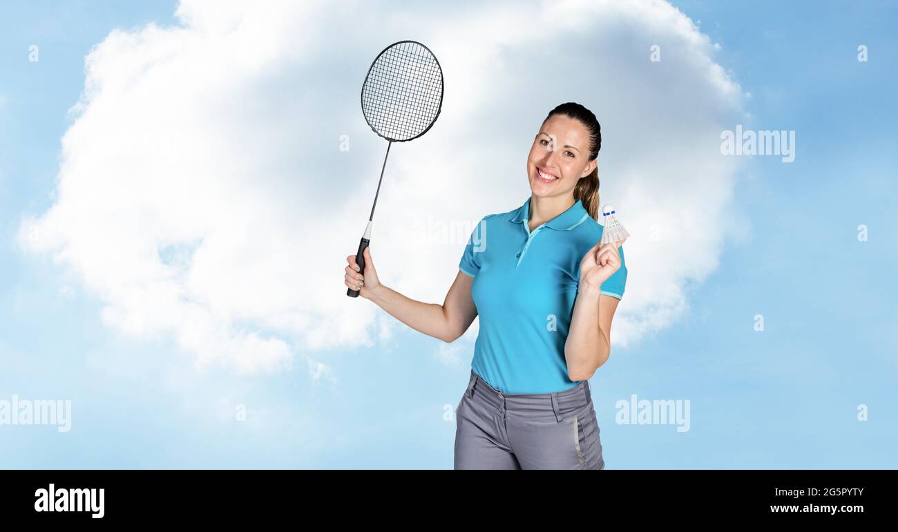 Portrait of caucasian female badminton player holding racket smiling ...