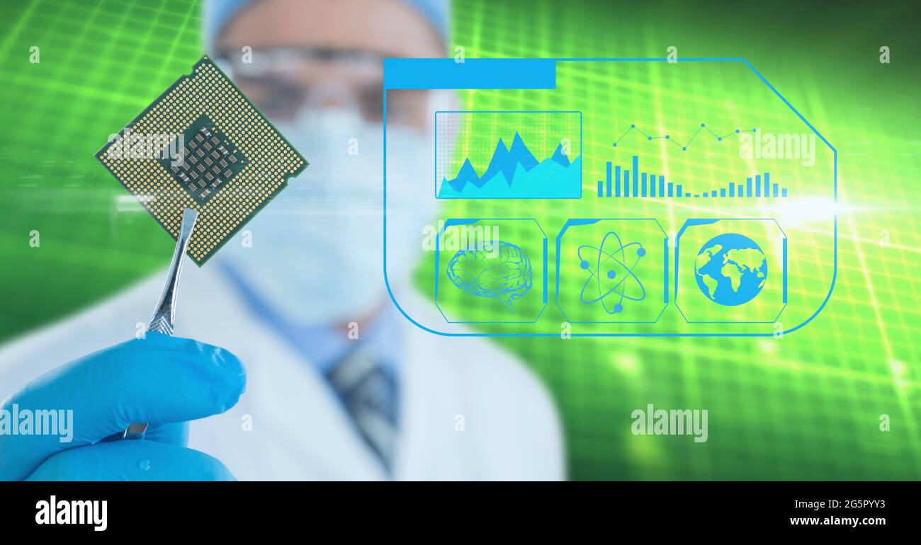 Medical icons over male doctor wearing face mask holding computer chip ...