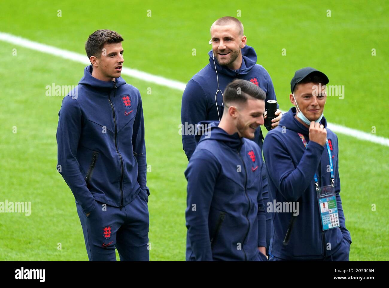 England's Mason Mount (left) and Luke Shaw inspect the pitch before the ...