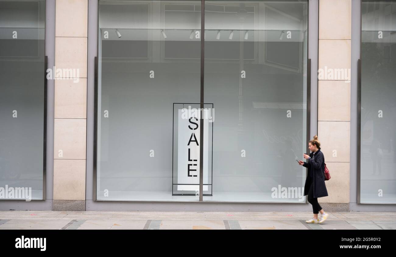 Oxford Street, London, UK. 29 June 2021. Austere window display with ...