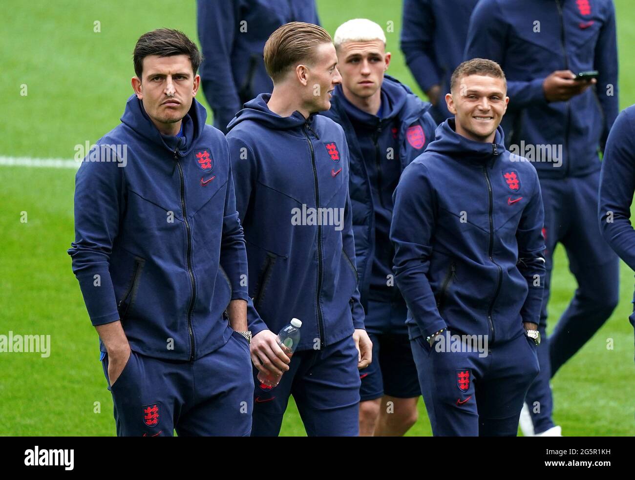 England' Harry Maguire (left), goalkeeper Jordan Pickford, Phil Foden ...