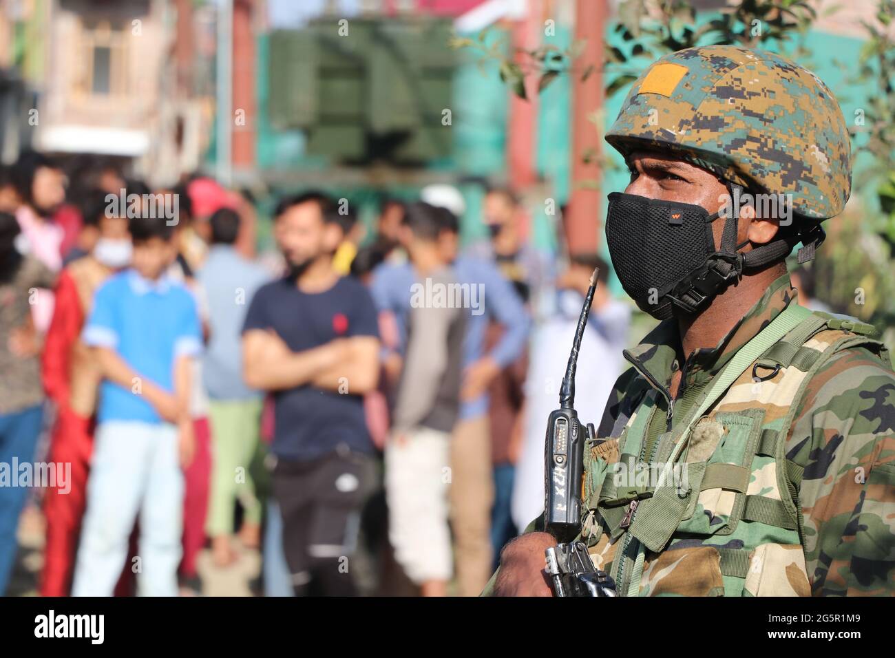 Srinagar, India, 29th June 2021. A paramilitary trooper wearing a face ...