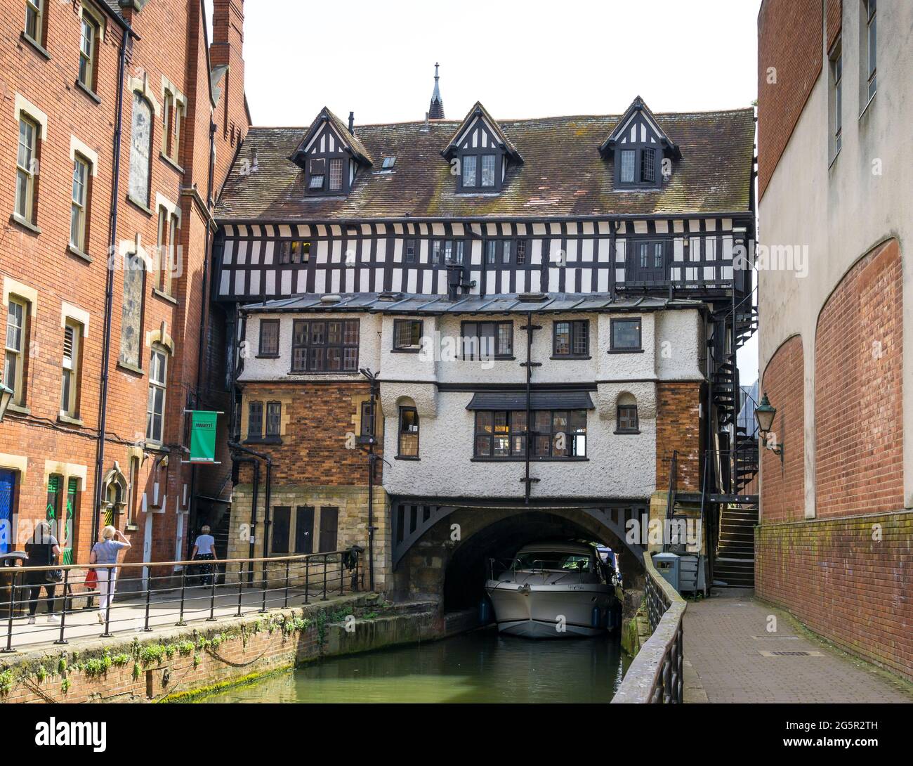 Rear elevation Stokes High Bridge Cafe with large river cruiser passing ...