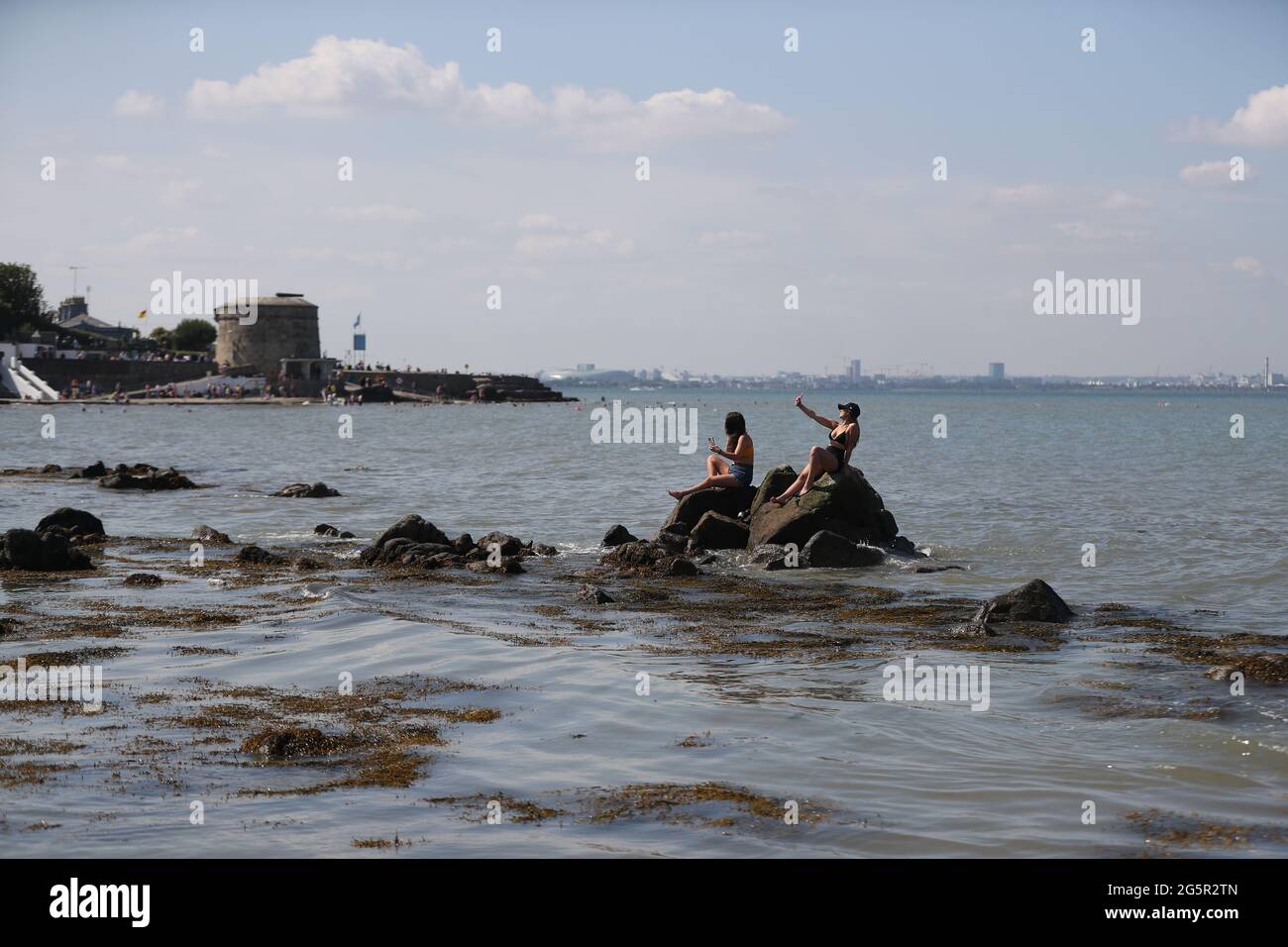 Ana Laura Santos (right) and Camilla Arribada enjoy the good weather at ...