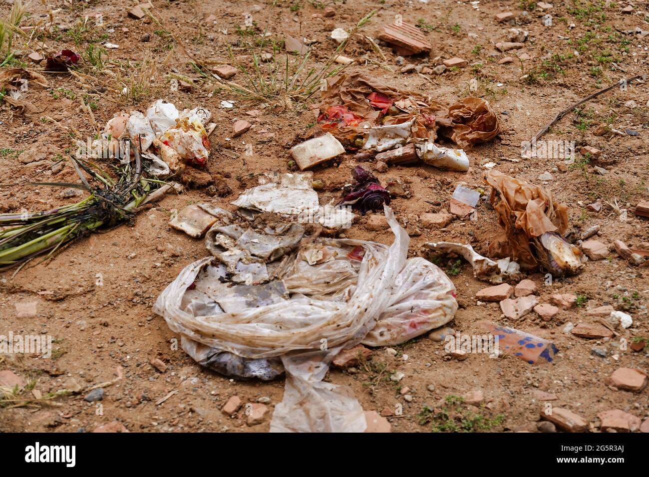 Shot of garbage on the ground Stock Photo - Alamy