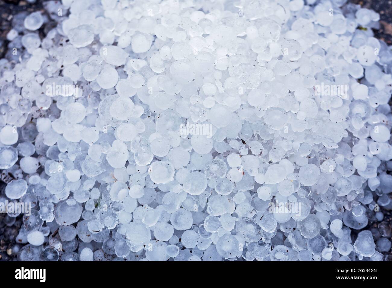 A pile of large hail on the ground Stock Photo - Alamy