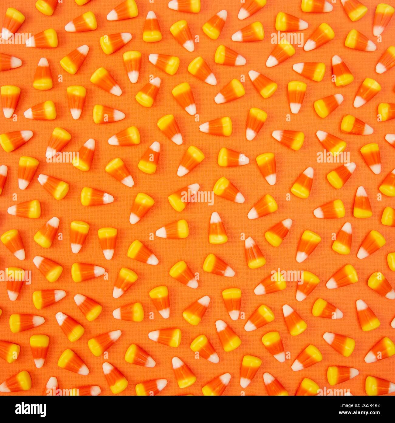 Square Candy Corn Background on an Orange Surface Stock Photo - Alamy