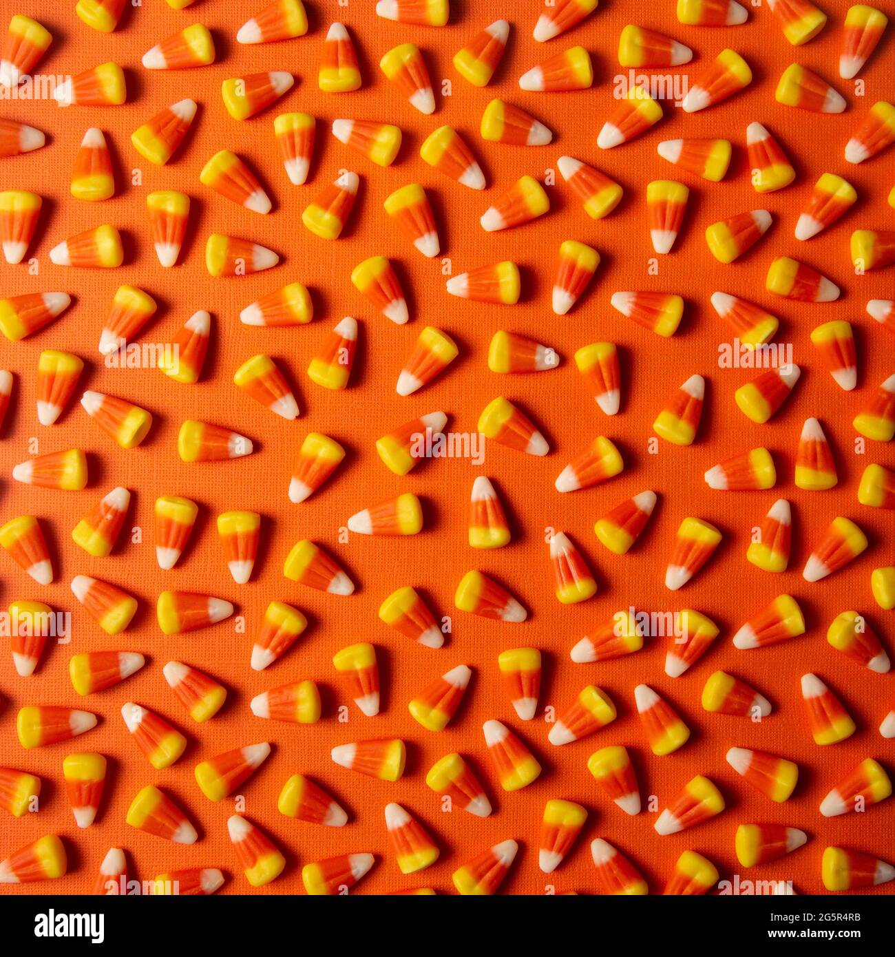 Square Candy Corn Background on an Orange Surface Stock Photo - Alamy