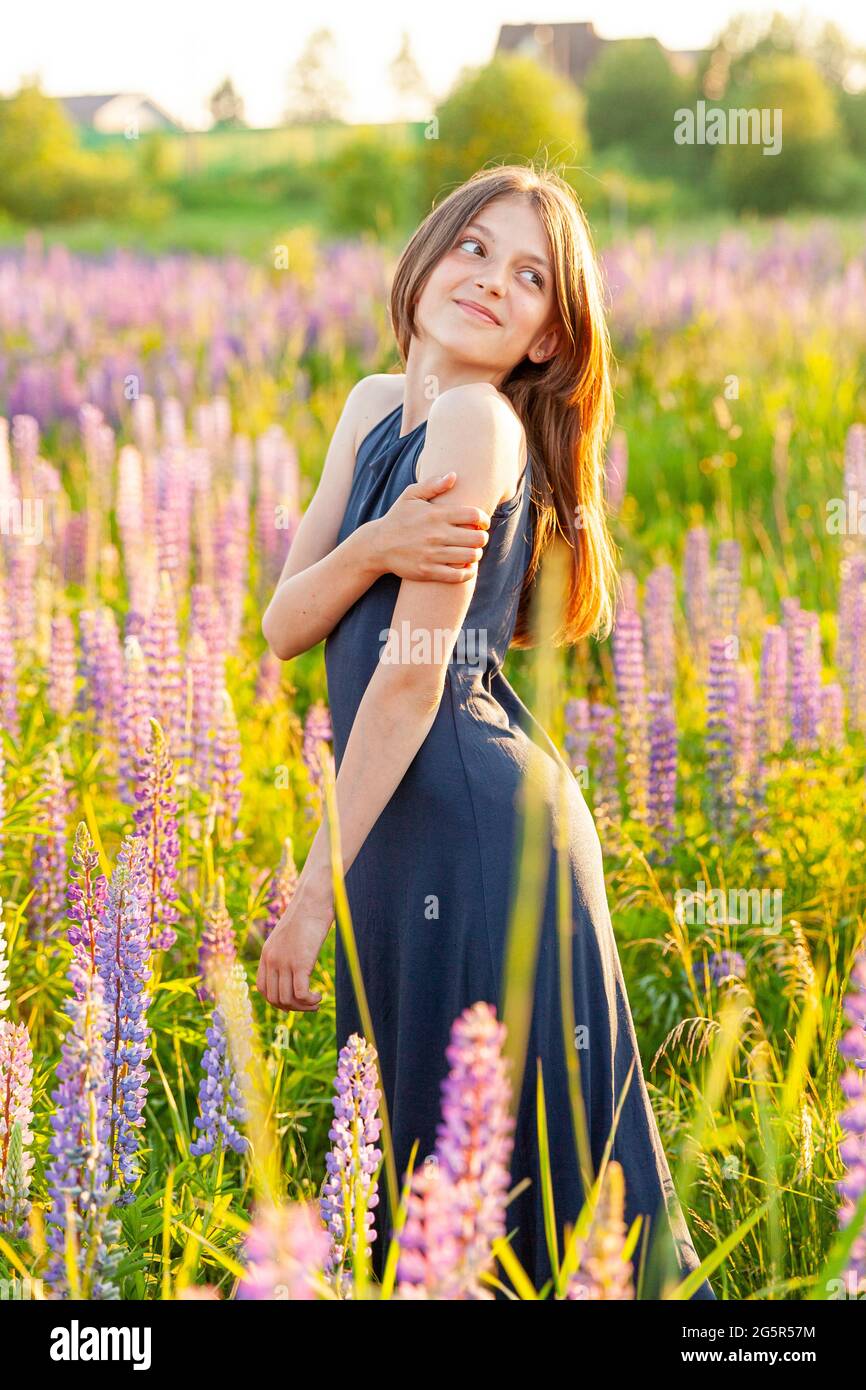 Happy teenage girl smiling outdoor. Beautiful young teen woman resting ...