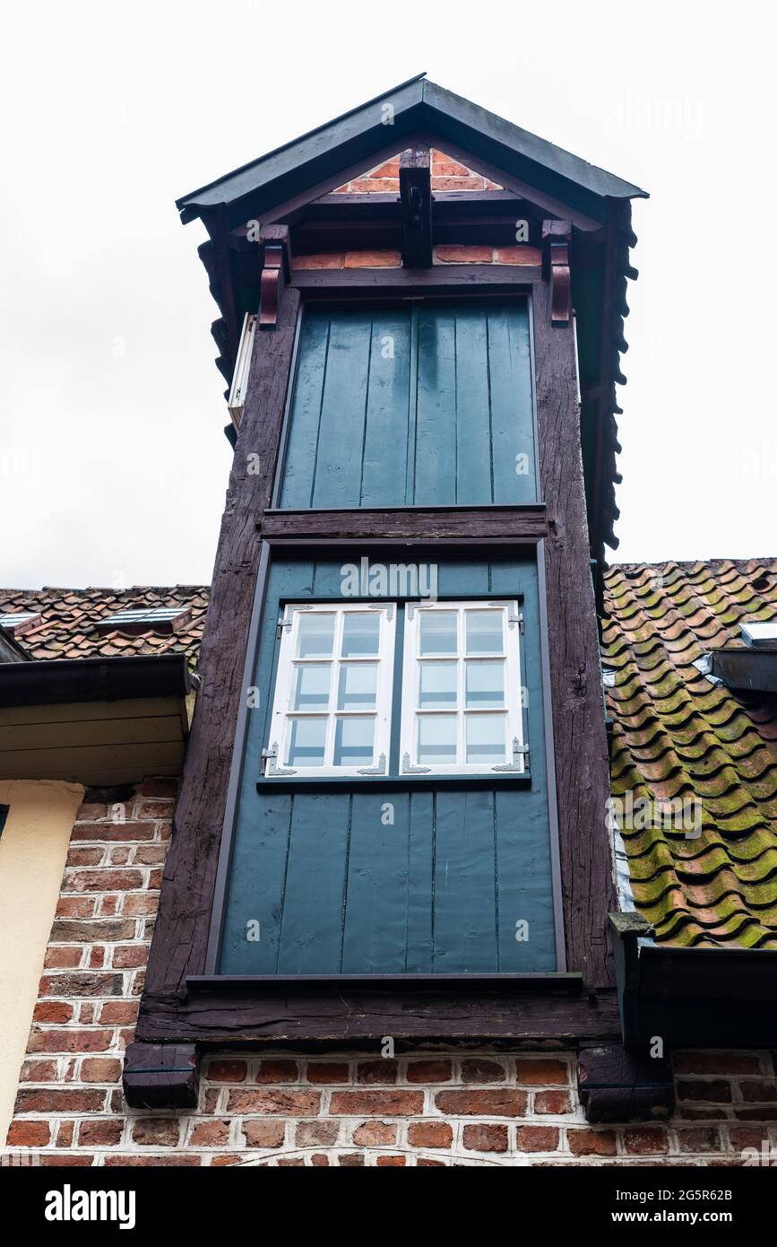 Window on the rooftop of an old medieval house in the old town of ...