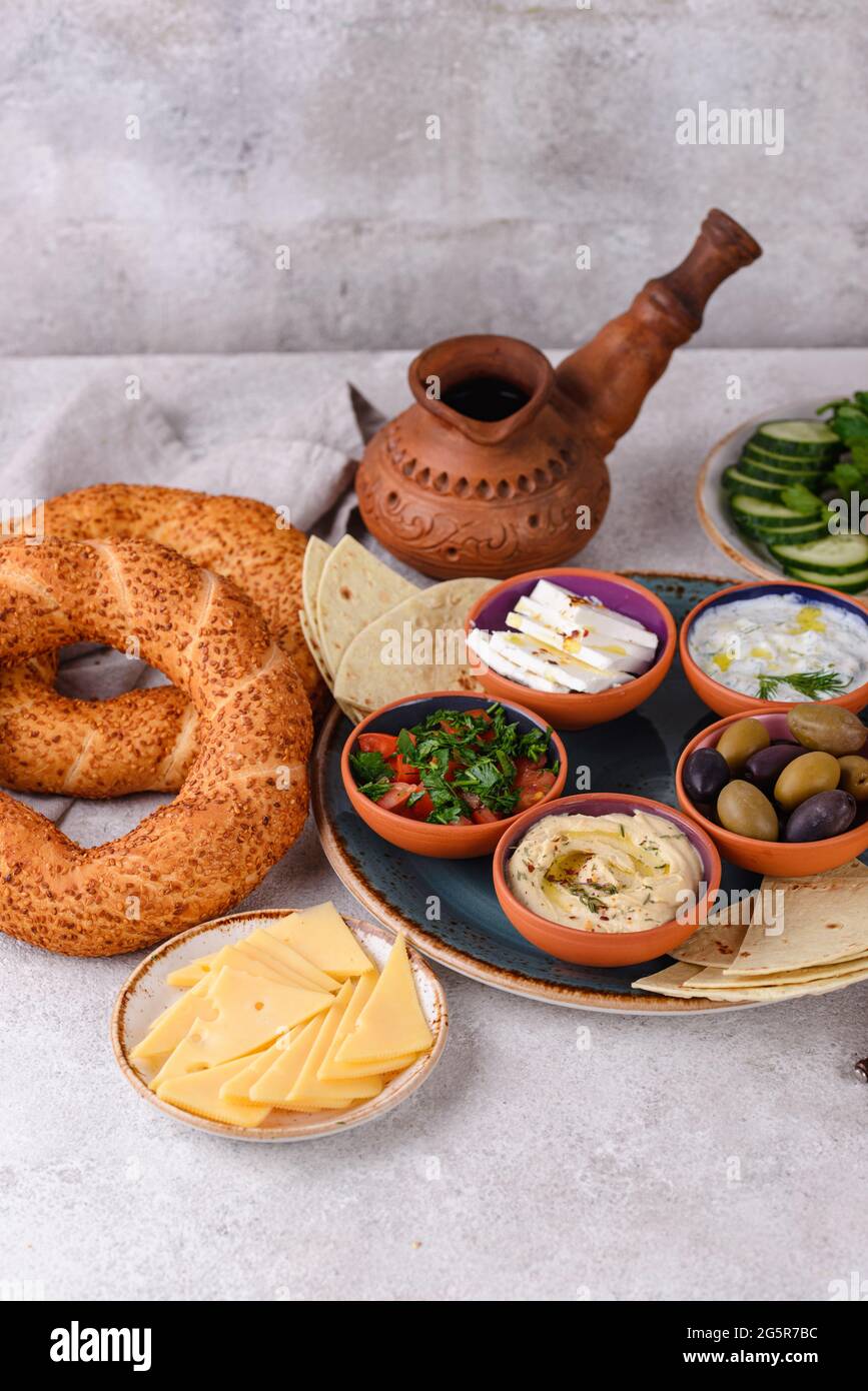 Traditional Turkish breakfast with meze and simit Stock Photo - Alamy