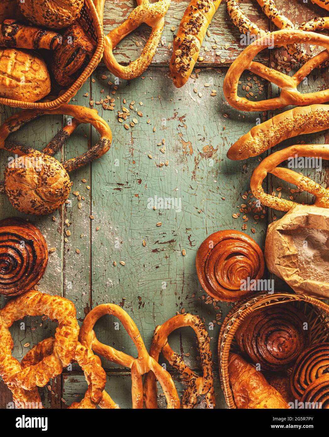 Frame of fresh sweet bakery assortment on wooden turquoise surface ...
