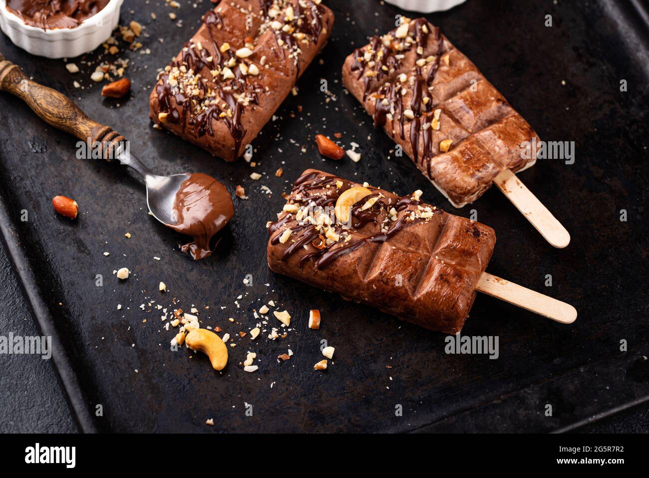 Chocolate ice cream popsicle with nut Stock Photo - Alamy