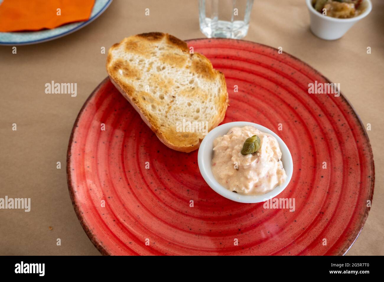 Toast with cheese sauce, a traditional starter in a Greek restaurant ...
