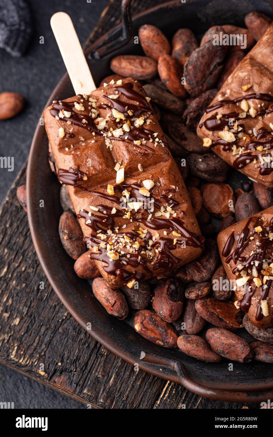 Chocolate ice cream popsicle with nut Stock Photo - Alamy