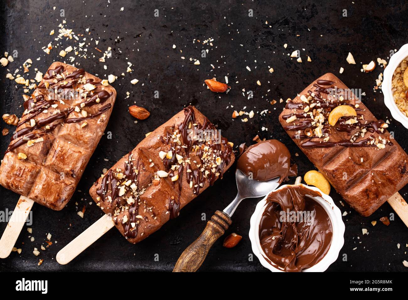 Chocolate ice cream popsicle with nut Stock Photo - Alamy