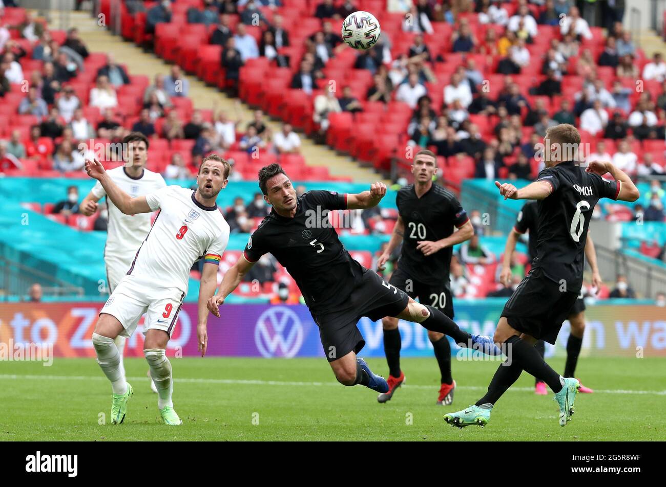 Germany's Mats Hummels (centre) clears the ball under pressure from ...