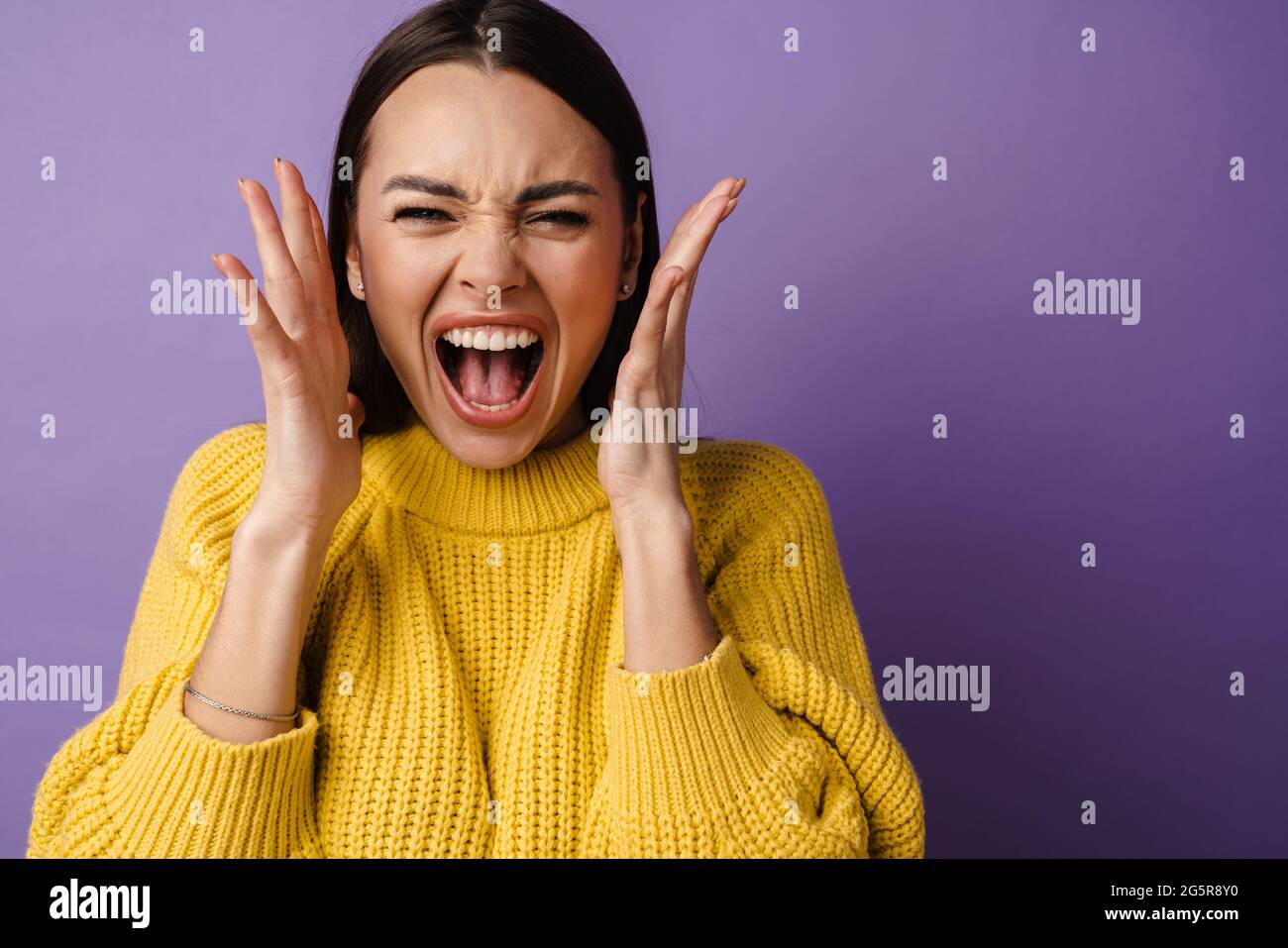Close-up portrait of angry, pissed-off aggressive woman screaming and ...