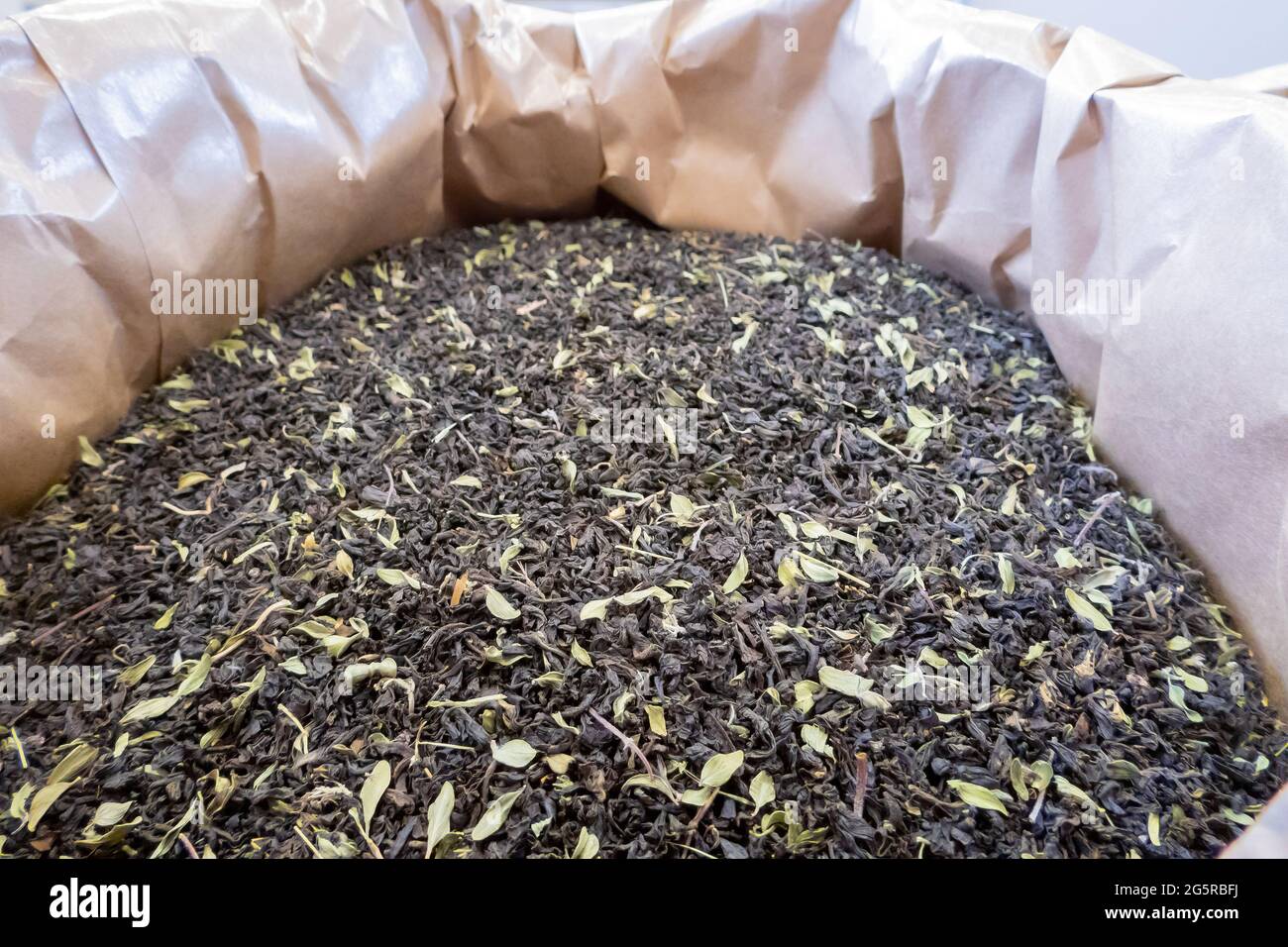Dried tea leaves in big paper sack. Close-up Stock Photo - Alamy