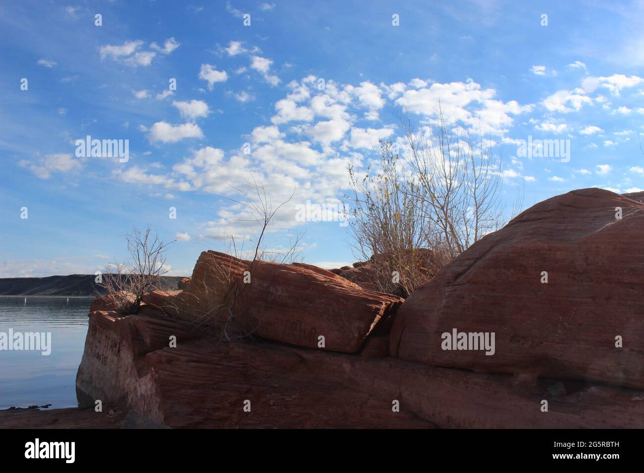 Hidden by rocks Stock Photo - Alamy